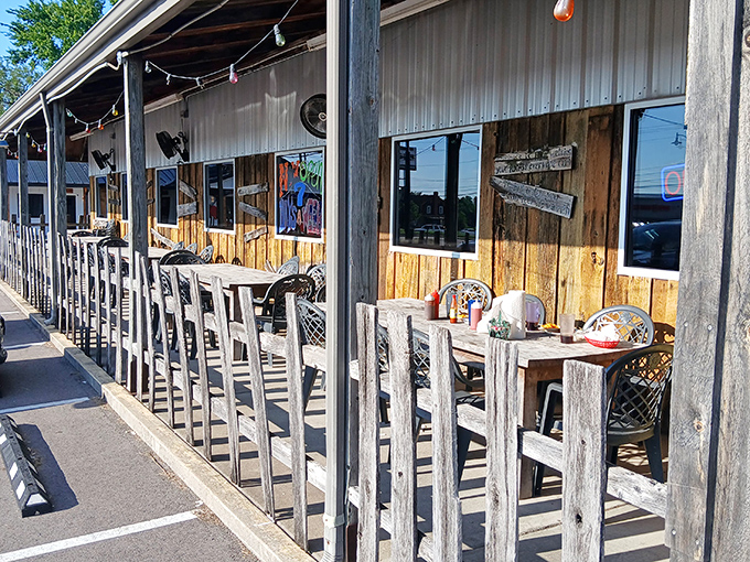 The outdoor seating area offers fresh air with your fresh catch—a rustic porch experience that enhances the down-home flavors.