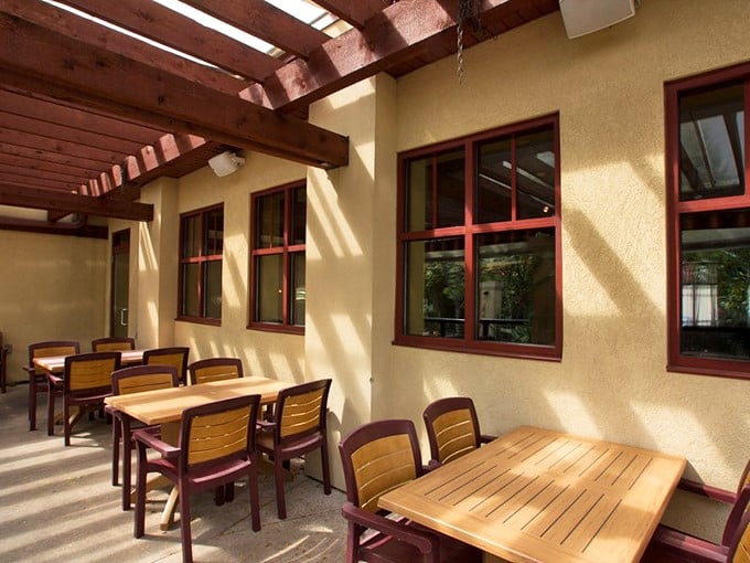 The outdoor patio—where summer evenings stretch into night, conversations flow freely, and nobody wants to be the first to suggest leaving.