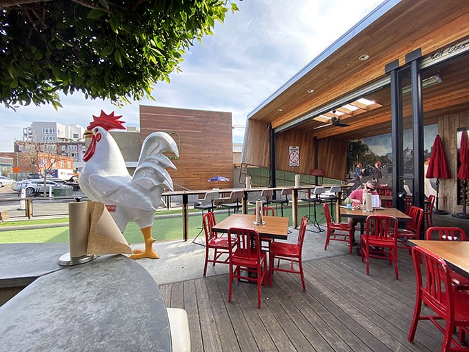 That iconic chicken statue watches over diners like a feathered guardian angel, silently judging those who don't clean their plates.
