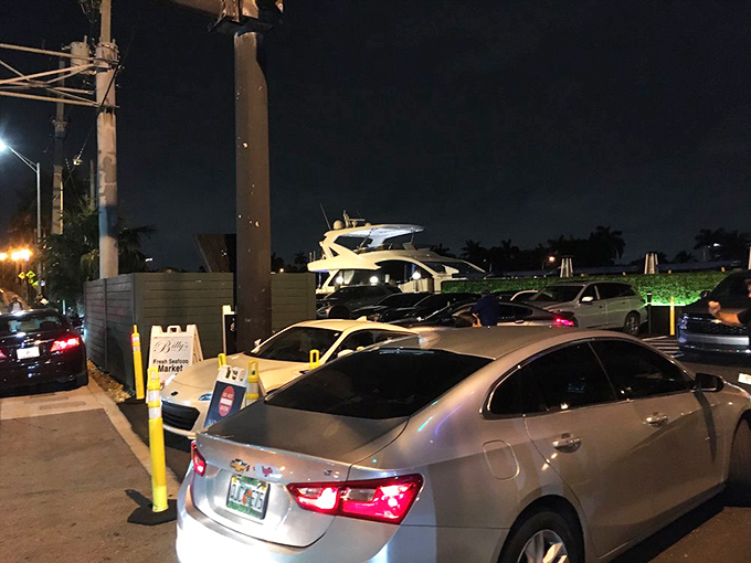 Even the parking lot hints at the experience within—boats visible beyond cars, promising a meal where land meets sea in delicious harmony.