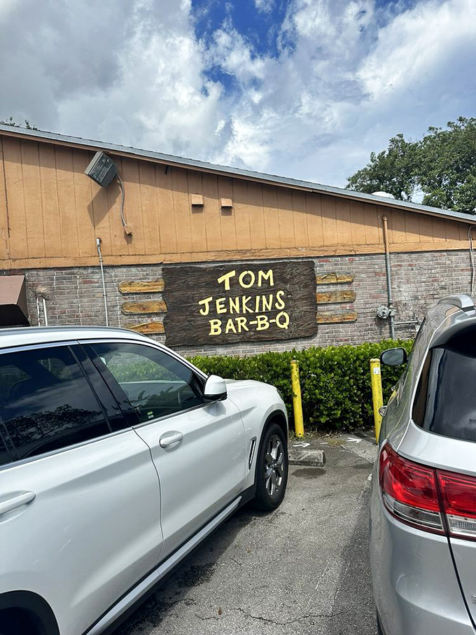 The parking lot—final resting place for empty stomachs. Cars from all over Florida make the pilgrimage to this temple of smoke.