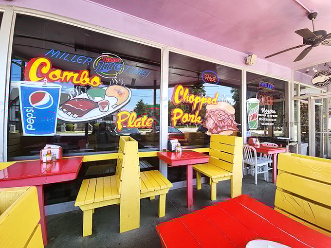 Outdoor dining with a view of neon promises, where every meal feels like a celebration.