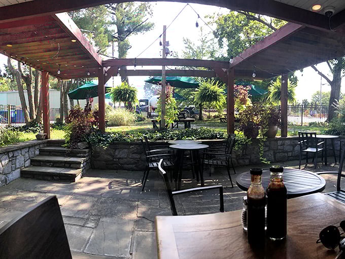 The outdoor patio offers a garden oasis for enjoying your smoky treasures, with sauce bottles standing by like faithful companions ready for duty.