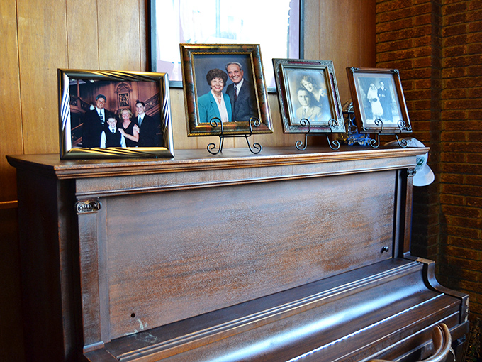 Family photos watch over diners like benevolent spirits. That piano has witnessed more Memphis stories than most historians—if only it could talk.