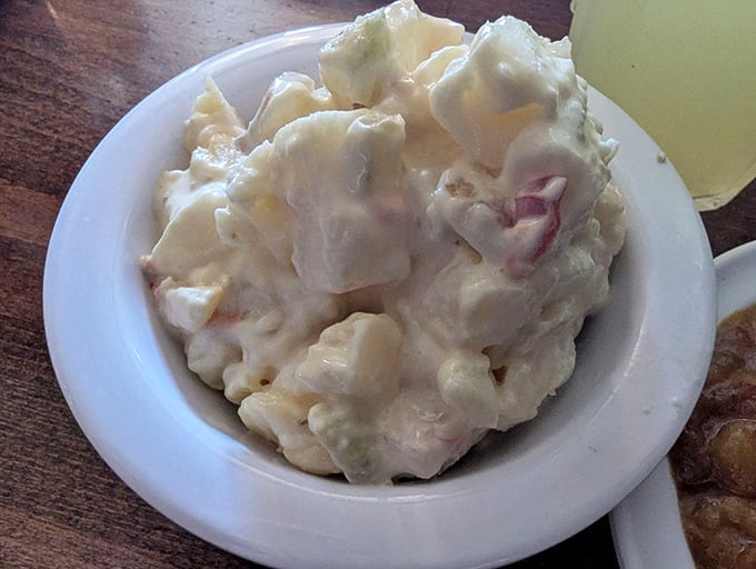 Potato salad that doesn't try to reinvent the wheel—just makes it creamier, tangier, and the perfect cool companion to hot meat.