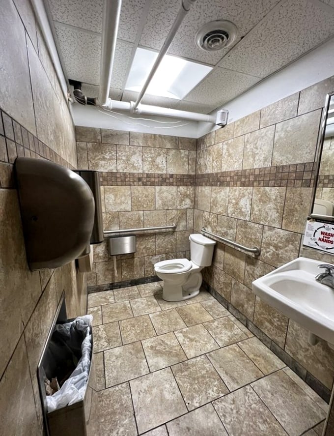 Even the restroom stays on theme—practical, clean, and without pretension. No fancy hand lotions here, just honest-to-goodness functionality.