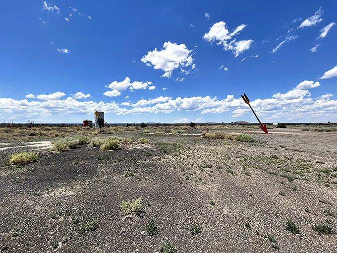 The desert reclaims its territory inch by inch, but that arrow refuses to surrender its post as guardian of Route 66 memories.