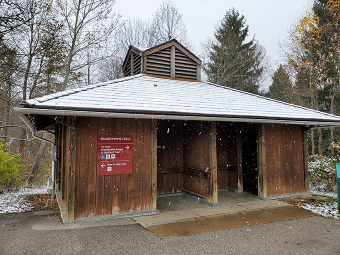 Even in snowfall, the visitor facilities remain ready for explorers. This rustic shelter has seen more seasons than most of us ever will.