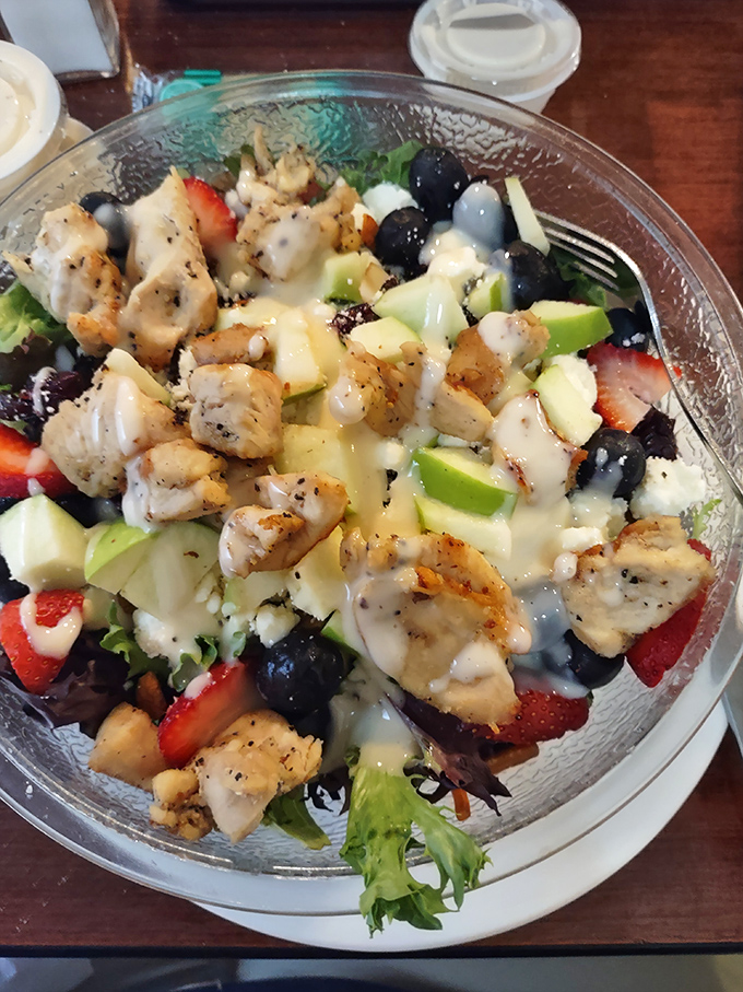 A salad that doesn't apologize for being healthy—it just brings along enough friends (chicken, fruit, and dressing) to make it a party. 