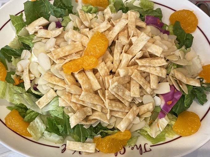 A salad that doesn't apologize for being healthy – it just smuggles in mandarin oranges and crunchy wonton strips for good measure.