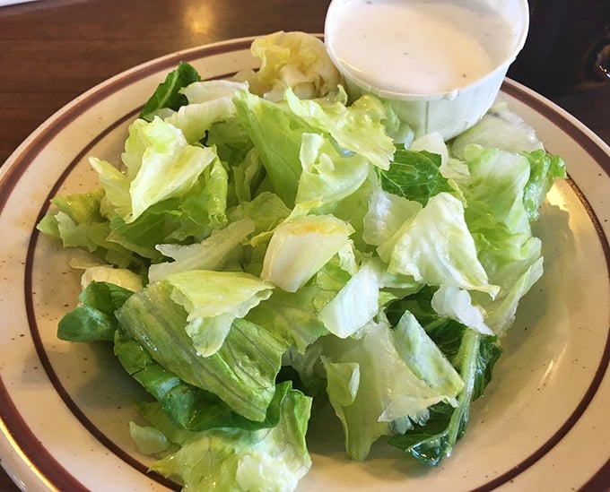 Even the side salad gets respect at Teddy's—crisp lettuce and a side of dressing in a proper ramekin. No sad, wilted afterthoughts here.