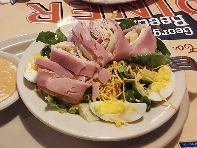 The chef's salad—where ham and cheese don't hide their diner roots behind fancy greens, just honest lunch that won't slow you down.