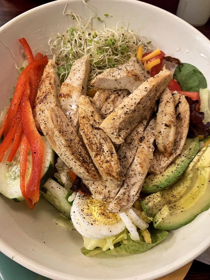 A salad that doesn't apologize for being healthy—it's too busy showing off perfectly seasoned chicken and fresh, crisp vegetables.