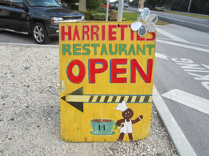 The hand-painted roadside sign featuring a cheerful chef practically guarantees you're about to eat well.