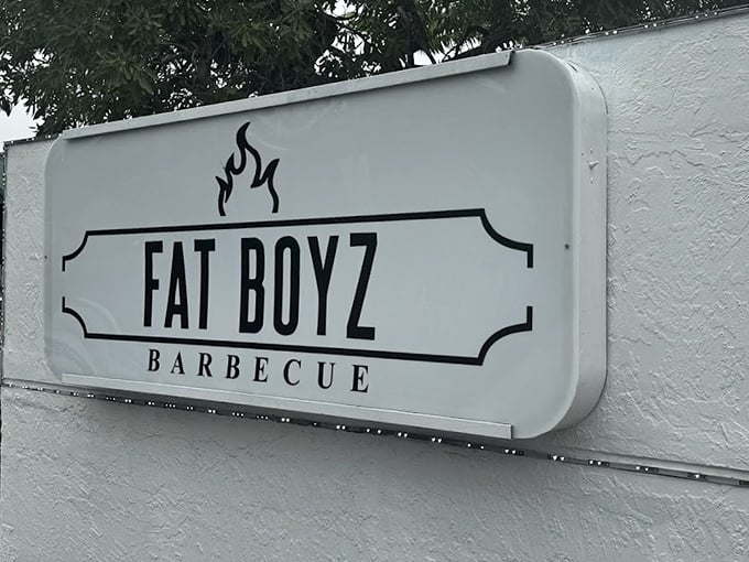 The sign doesn't need to shout—it knows the reputation that follows those two simple words: "Fat Boyz Barbecue."