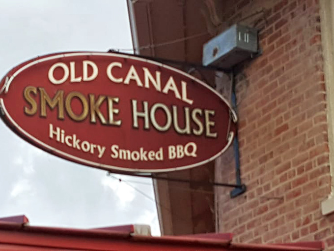 That classic sign promising hickory-smoked BBQ – sometimes the best things come with simple promises.