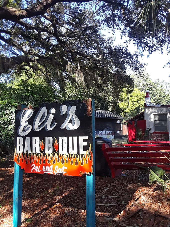 The sign says it all: "Eli's Bar-B-Que" with flames that aren't just decorative—they're a promise of what awaits inside.