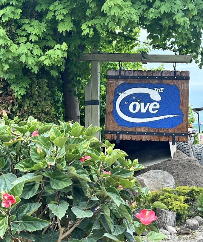 The sign that signals you've arrived at Michigan's whitefish wonderland. Those flowers aren't just blooming—they're celebrating your excellent taste in restaurants.