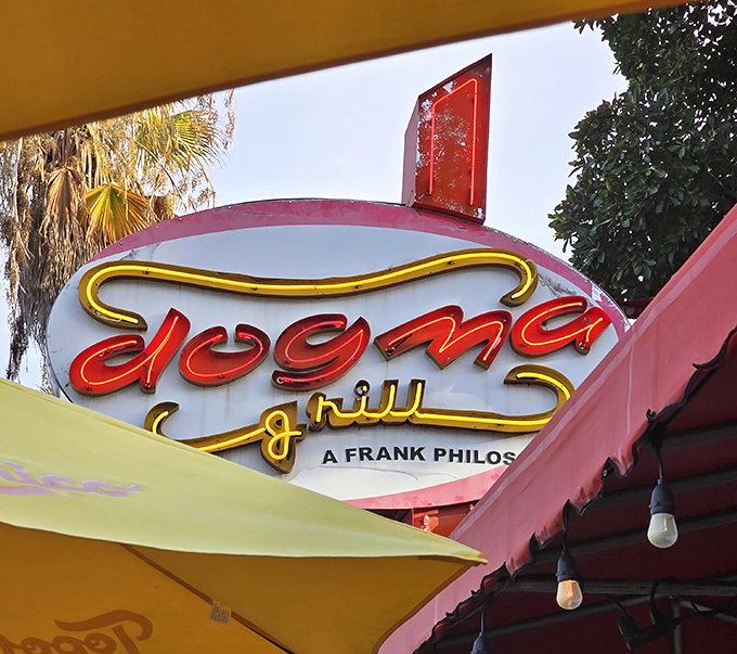 The neon sign that's guided hungry souls for years. Dogma's retro signage glows with the promise of frankfurter fulfillment just steps away.