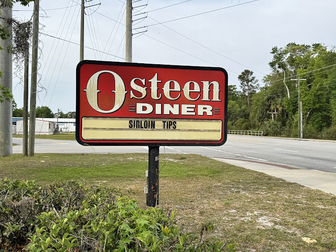 The roadside sign stands as a beacon of hope for hungry travelers. When you see "Sirloin Tips" on the marquee, you know you've found the real deal.