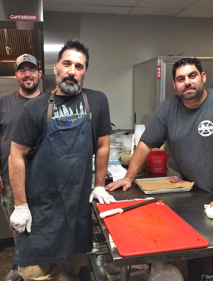 The pitmasters behind the meat magic—skilled hands wielding knives and tongs with the precision of surgeons and the soul of artists.