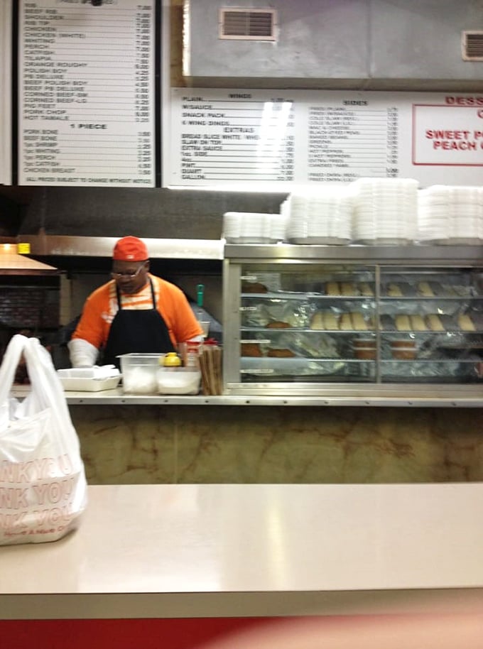 The maestro at work behind the counter. Those hands have probably prepared more perfect wings than most of us have had hot dinners.