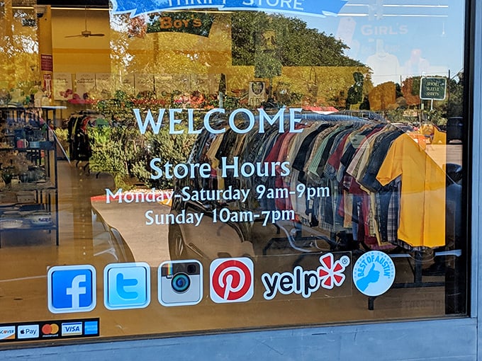 The storefront window reveals the holy grail of thrift store information: extended hours seven days a week. Bargain hunters rejoice – treasure awaits daily!