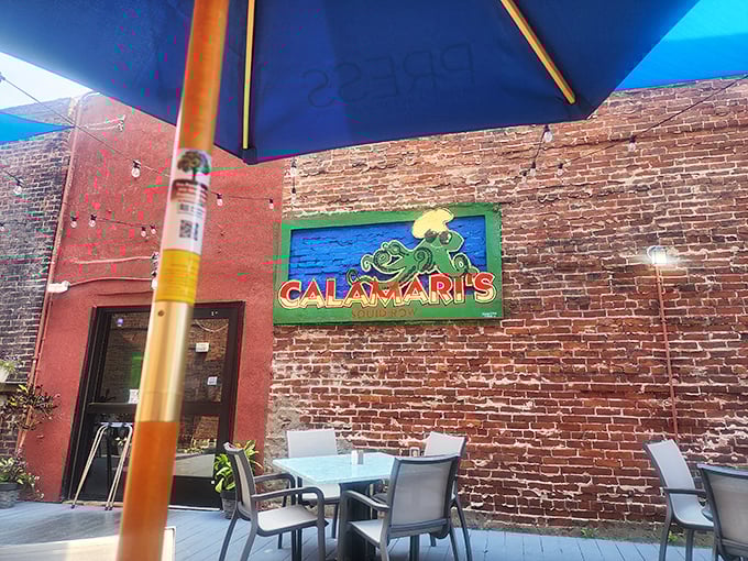 The outdoor sign featuring a cartoon squid promises whimsy with your meal. In Erie, even seafood mascots know how to have fun.