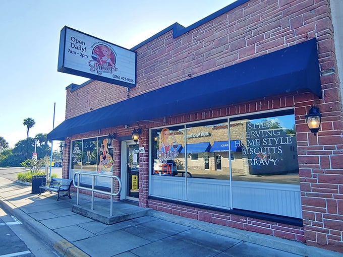 The storefront proudly advertising "home style biscuits & gravy"—words that have caused many a car to make sudden, unplanned turns into the parking lot.
