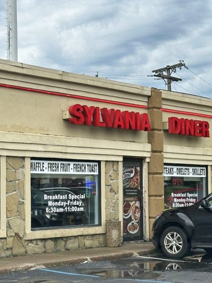 Rain-slicked pavement reflects the iconic red signage—a beacon of comfort food hope on a gray Ohio day.