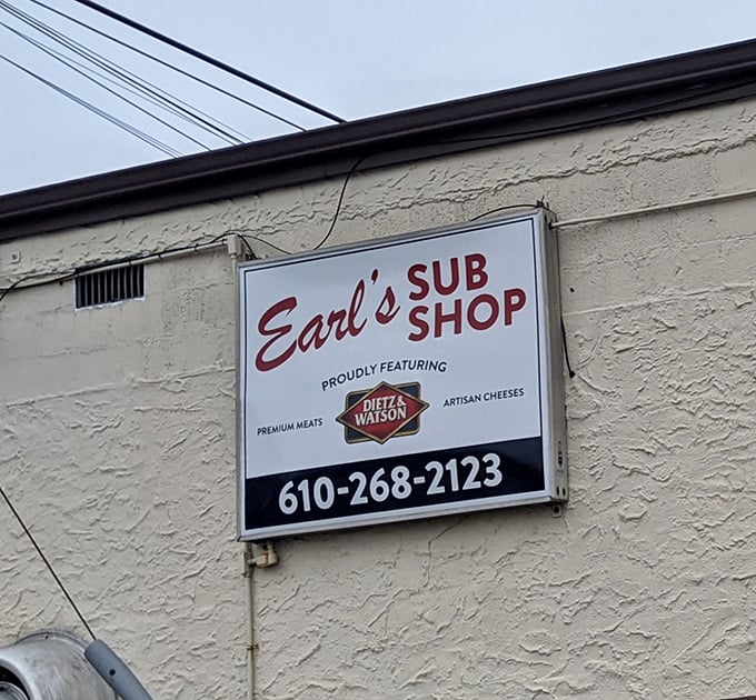 The sign proudly announces Earl's commitment to quality: Dietz & Watson premium meats and artisan cheeses aren't just ingredients, they're a philosophy.