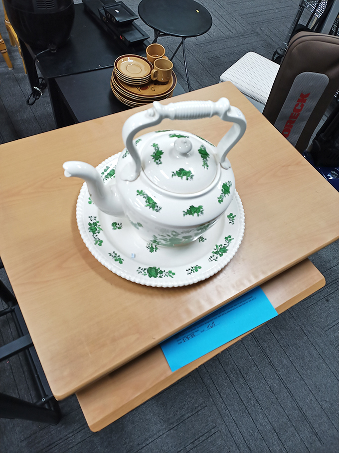 This delicate teapot with matching saucer isn't just kitchenware—it's a portal to more civilized afternoons filled with conversation and cookies.