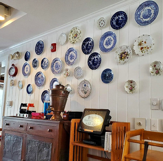 Decorative plates adorn the wall like edible art—a gallery exhibition where the main attraction is what's on your actual plate.