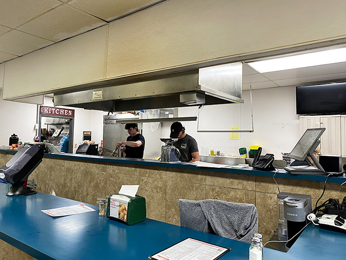 Where the magic happens—skilled hands working the grill with the precision of surgeons and the timing of jazz musicians. Sandwich artistry in motion.