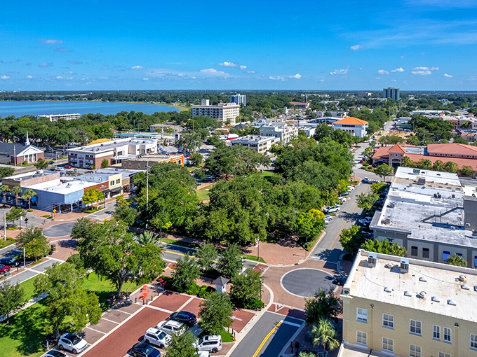 An aerial view reveals Winter Haven's perfect balance of nature and development—like someone actually consulted a city planner who enjoyed trees.
