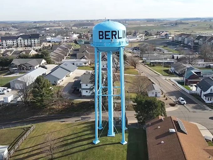 The blue water tower stands as Berlin's modern landmark, overlooking a community that beautifully balances yesterday's traditions with today's necessities.