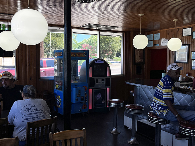 Even the arcade corner understands that some pleasures—like diners and classic games—never need upgrading to remain perfect.