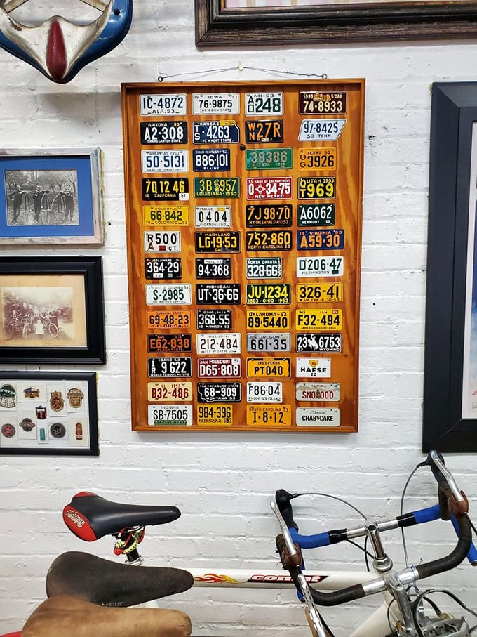 A collection of bicycle license plates spans decades of American cycling history. Remember when kids had to register their Huffys?