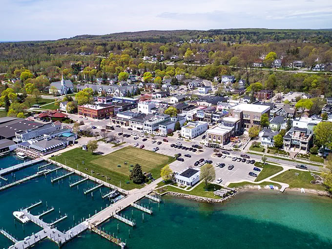 From above, Harbor Springs reveals its perfect positioning—nestled between emerald hills and crystal waters like nature's version of the perfect sandwich.