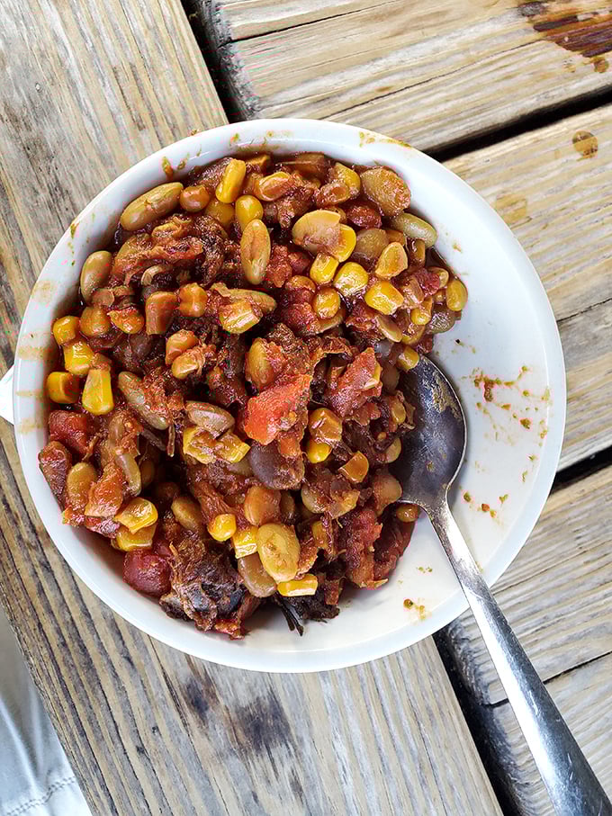 Brunswick stew that doesn't just warm your stomach—it tells Georgia's culinary story in every bean, corn kernel, and tomato-soaked bite.