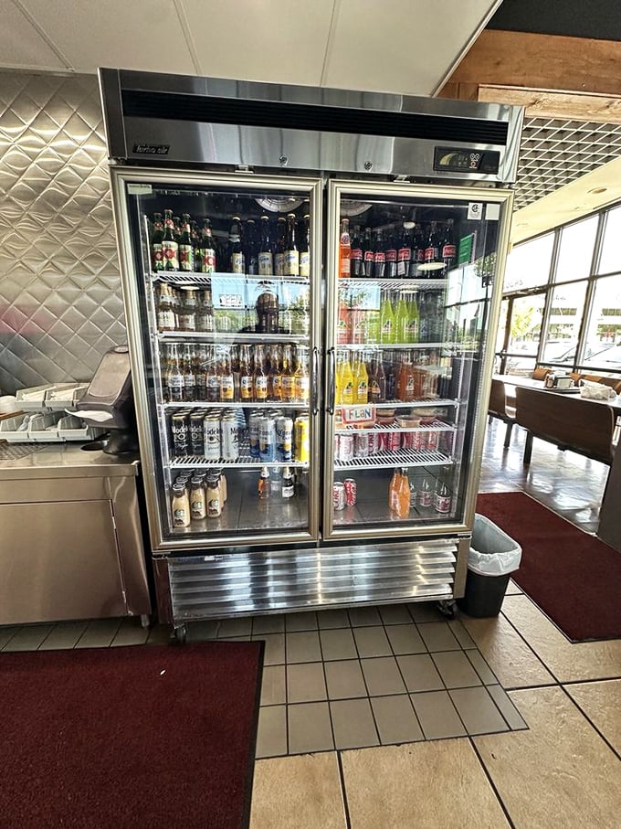The beverage cooler—that glorious wall of refreshment standing ready to extinguish the flames of even the most ambitious salsa sampling expedition.