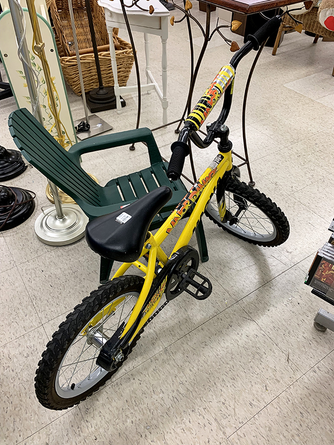 A sunshine-yellow bike that's begging for neighborhood adventures – proof that childhood joy can be recycled and passed along at Goodwill prices.