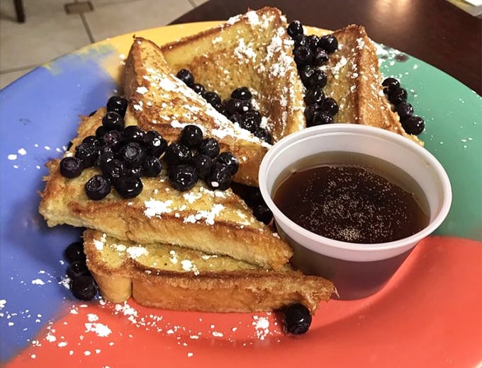 French toast dusted with powdered sugar and crowned with blueberries—breakfast that doubles as dessert without a hint of judgment.