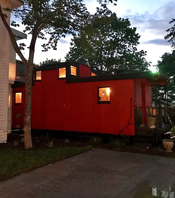 The red caboose isn't just quirky architecture—it's a dining space that promises your meal will be anything but ordinary.
