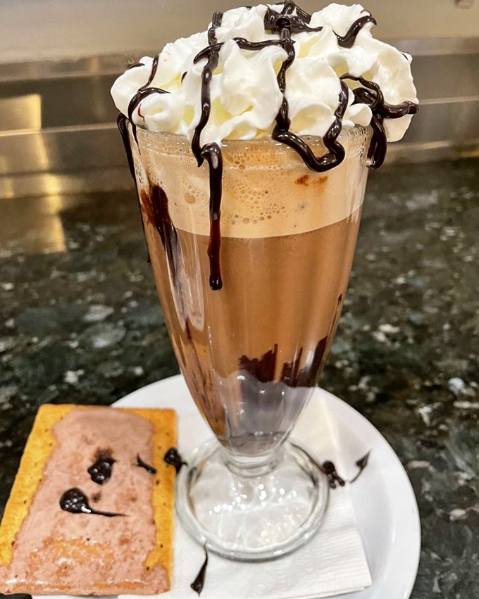 This isn't just a mocha—it's dessert in disguise, topped with enough whipped cream to make your diet plan file for divorce.