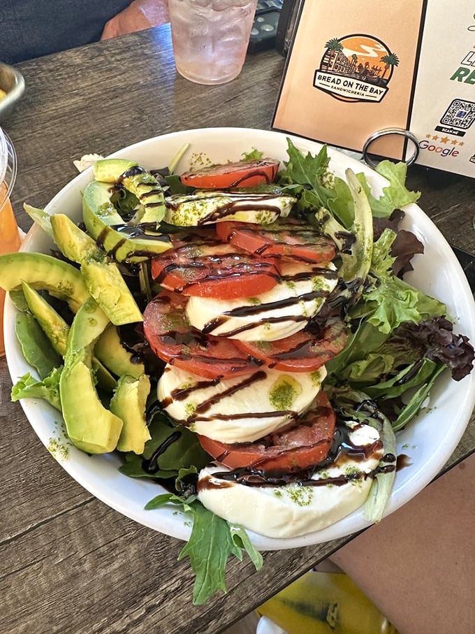 A Caprese salad that looks like it just returned from a semester abroad in Italy. Those balsamic drizzles aren't just decoration—they're flavor roadmaps.