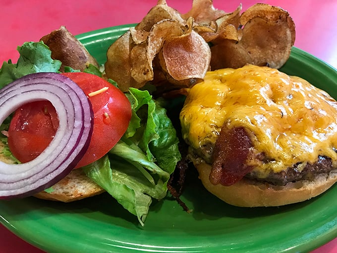 A cheeseburger that doesn't need fancy toppings to impress – just perfectly melted cheese, fresh veggies, and a bun that knows its supporting role.