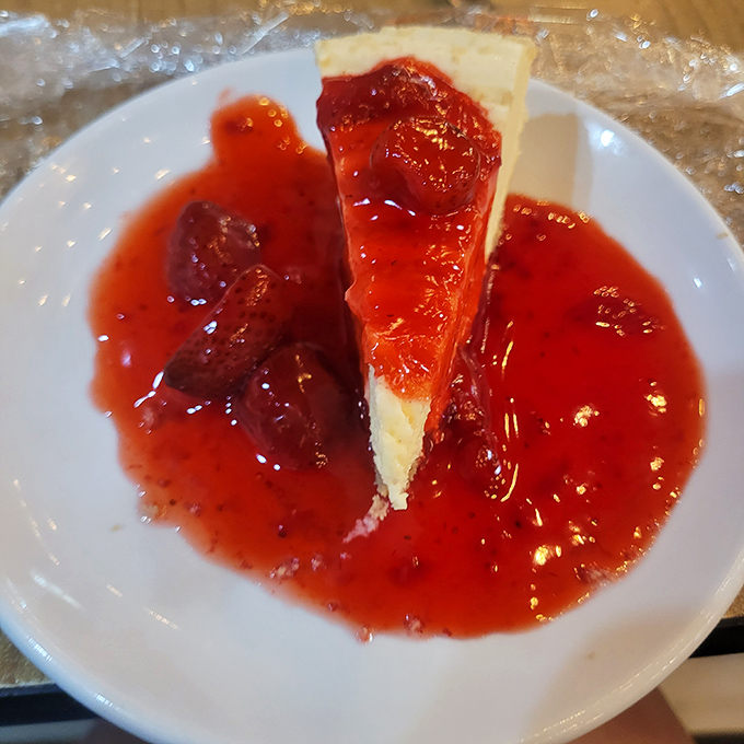 That's not just cheesecake—it's the sweet finale to your seafood symphony. The strawberry topping adds the perfect crimson curtain call.