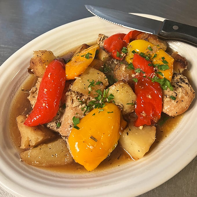 Chicken Vesuvio—the dish that proves potatoes and poultry were meant to swim together in garlic-infused olive oil.
