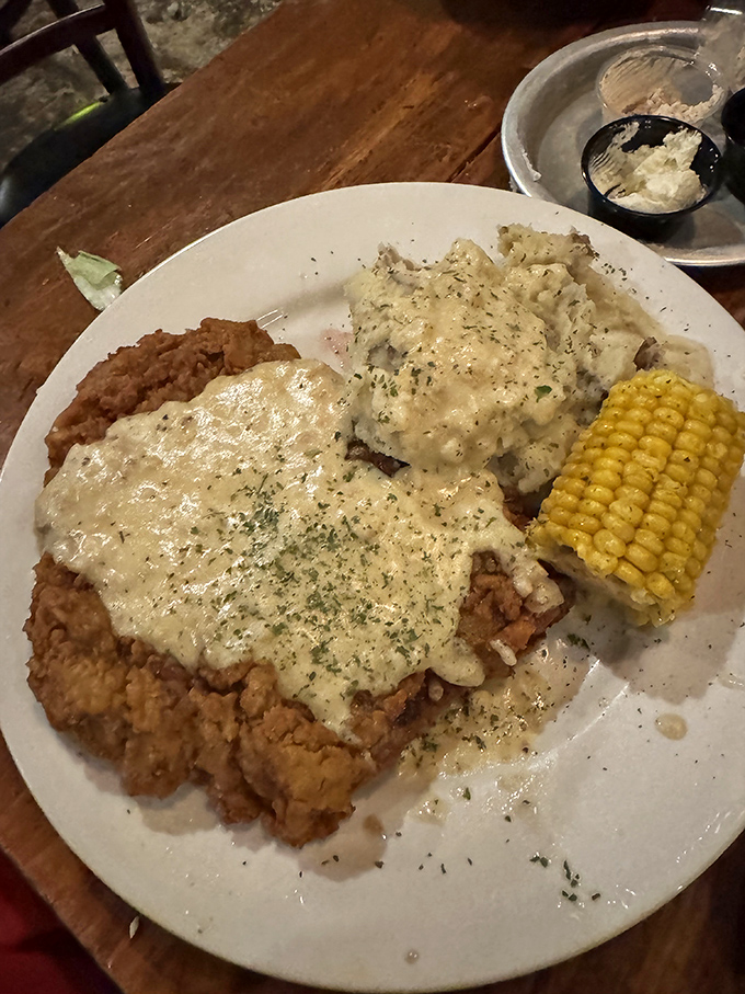 Chicken fried steak drowning in gravy—comfort food that makes your grandmother's cooking seem almost restrained.